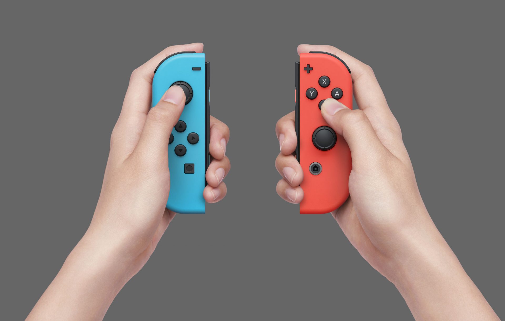 nintendo_switch_red_blue_joycons_in_hand_close_up – Game Climate